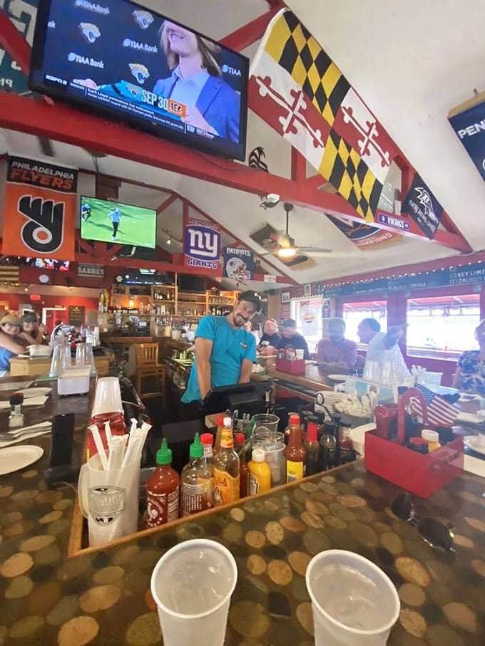Behind every great bar is a greater bartender, armed with an arsenal of hot sauces and cold drinks. The wizard behind the seafood curtain.