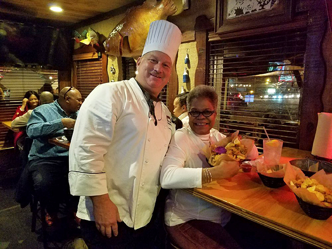 The chef's smile says everything you need to know - pride in presentation and confidence that your taste buds are about to throw a party.