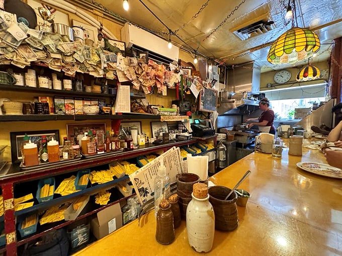 A kitchen where breakfast magic happens daily. Notice the wall of memories&mdash;customers have been leaving their mark here for decades.