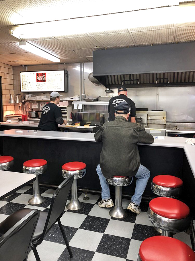 The kitchen crew at Smitty's moves with the practiced precision of people who have transformed tenderloin-making into an art form. No wasted motions, just pure expertise.