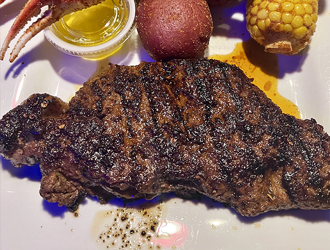 A steak so perfectly seared it deserves its own spotlight. Even in a seafood joint, this turf option holds its own against the surf competition.