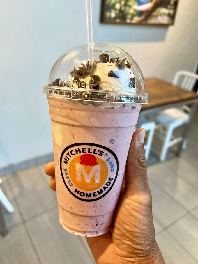 This isn't just a milkshake&mdash;it's a portable celebration topped with what appears to be cookie confetti. The straw is merely a delivery system for joy.