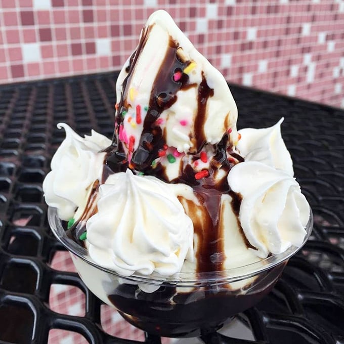 Not just a sundae&mdash;it's architecture. Hot fudge cascading down vanilla peaks with whipped cream clouds and a sprinkle rainbow.