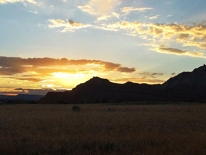 Golden hour magic turns the landscape into a painter's dream. Even the clouds seem to pause and admire the show.