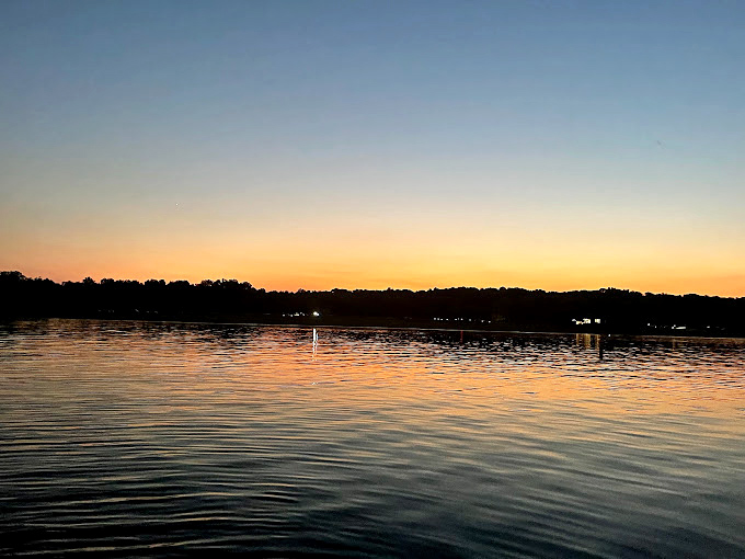 Sunset transforms Alum Creek into liquid gold, that magical hour when even amateur phone photos look like they belong in National Geographic.