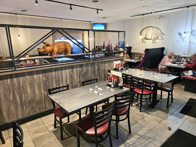 The dining room where barbecue dreams come true. That pig on the ledge isn't decoration&mdash;it's the patron saint of pork.