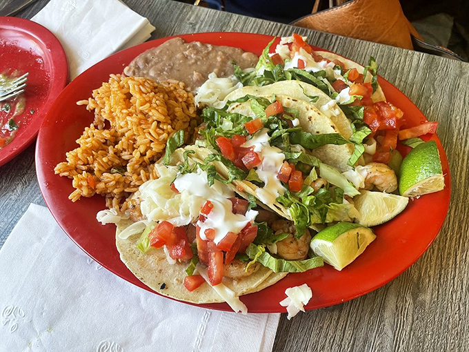 Behind the counter, culinary magic happens with efficiency and precision—the kitchen ballet that produces those perfect plates.