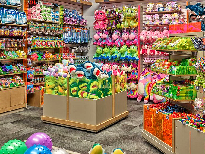 Stuffed animal heaven or parents' packing nightmare? This rainbow explosion of plush creatures ensures no child leaves without a souvenir larger than your suitcase.