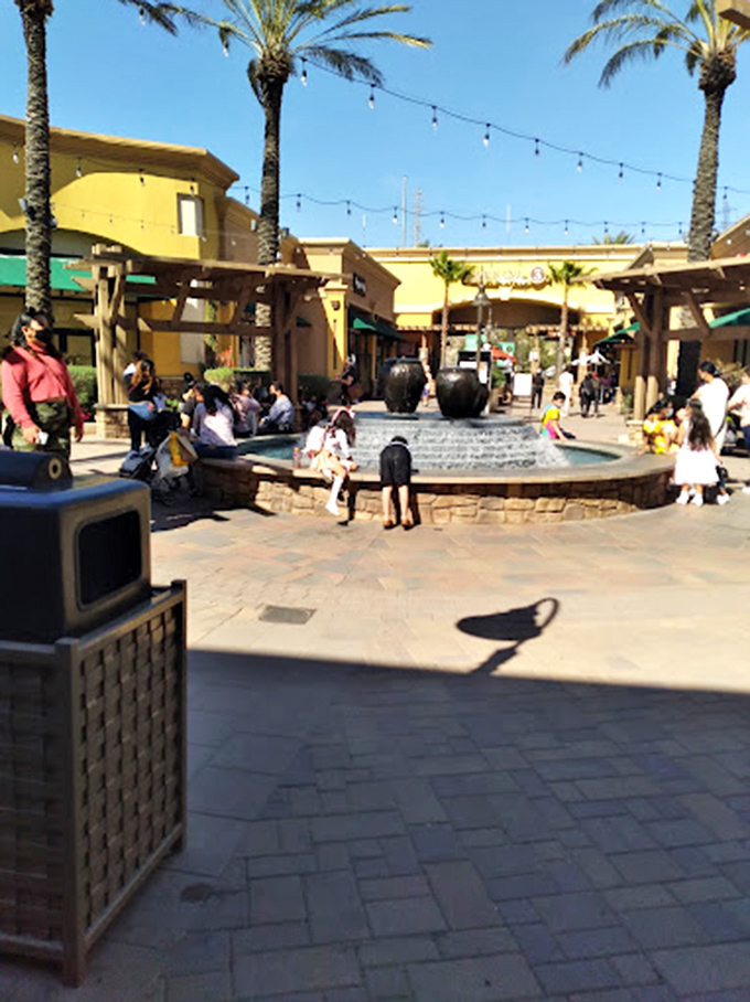 Shopping center fountains: where weary bargain hunters gather to compare scores and plan their next retail assault.