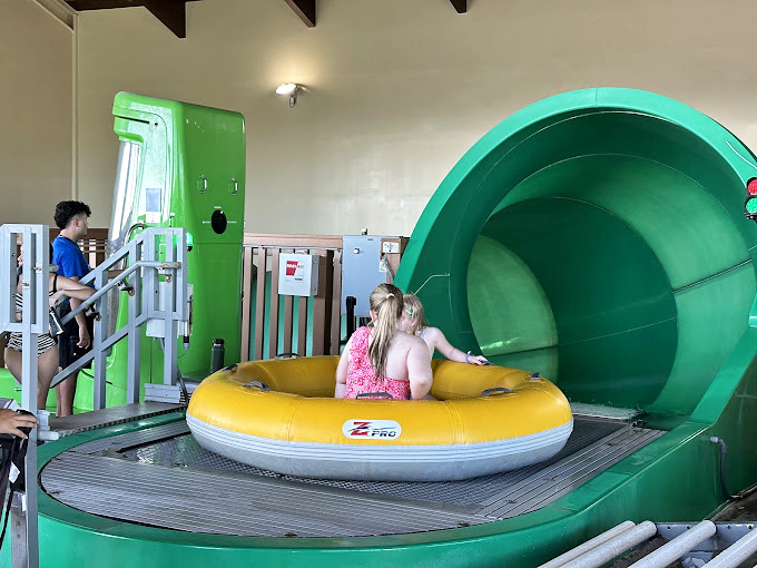 Water slide attendants: the unsung heroes who've mastered the perfect blend of safety enforcement and not spoiling anyone's fun. 