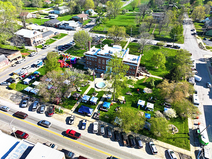 From above, Munfordville's courthouse square reveals itself as the town's beating heart. Those tiny dots are people gathering for what's likely the social event of the season.