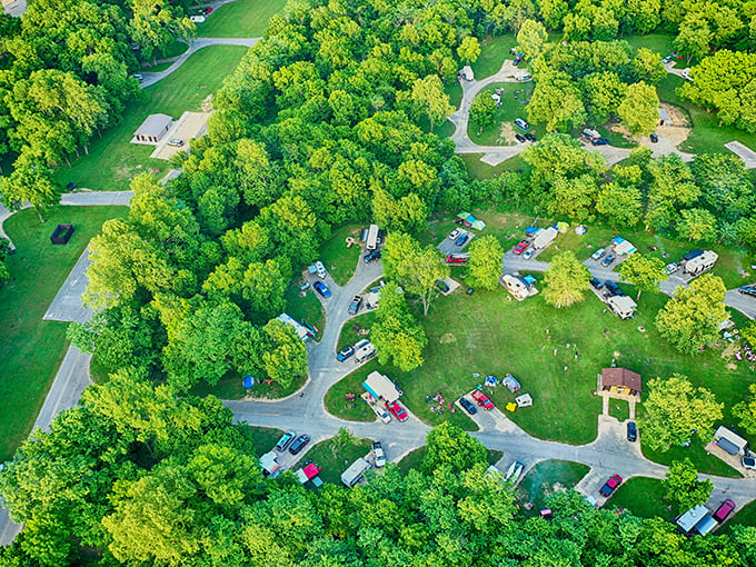 An aerial view reveals how perfectly the campground nestles into the forest &ndash; human presence in harmony with nature, not fighting against it.