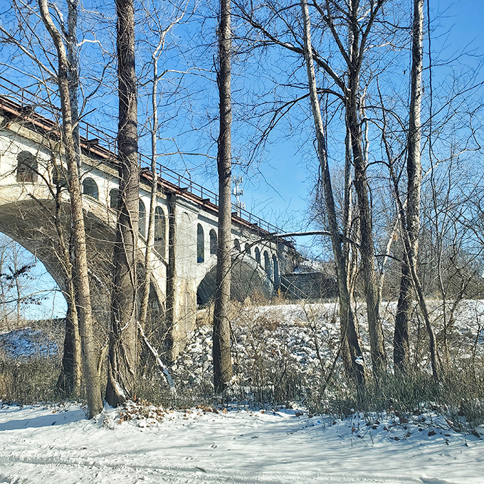 Sunlight showcases the bridge's impressive engineering and stonework. By day, it's easier to appreciate as a historical landmark rather than a haunted hotspot.