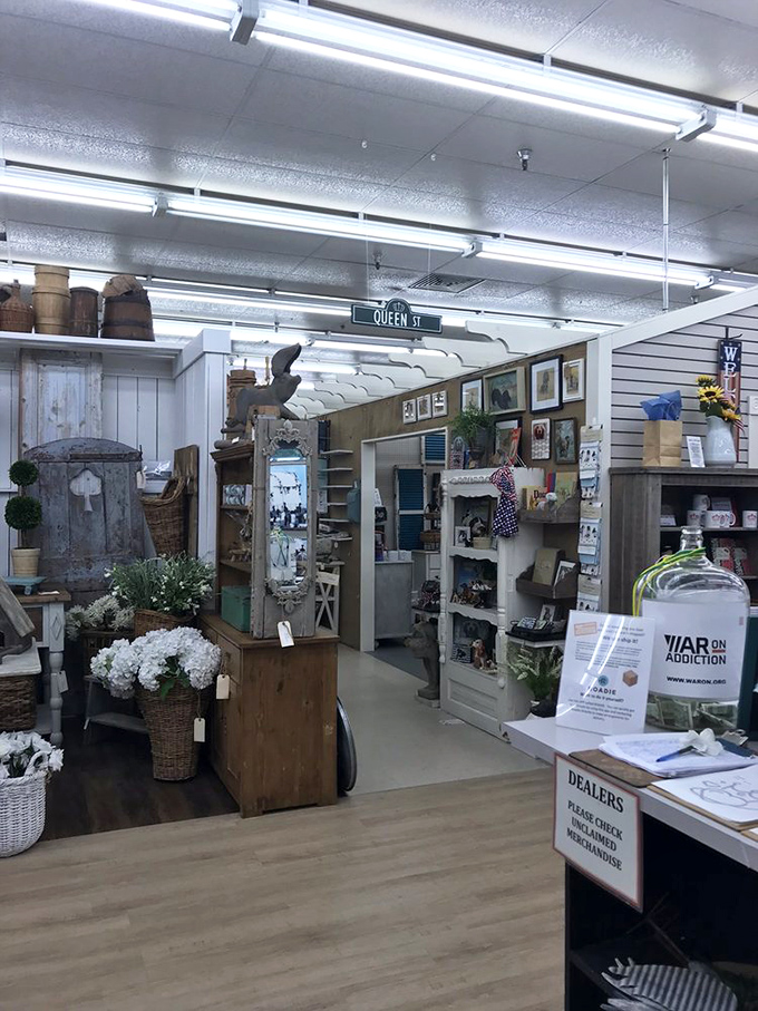 Vendor booths flow into one another like chapters in a fascinating novel. The "Queen St" sign overhead reminds you that in this kingdom, vintage treasures reign supreme.