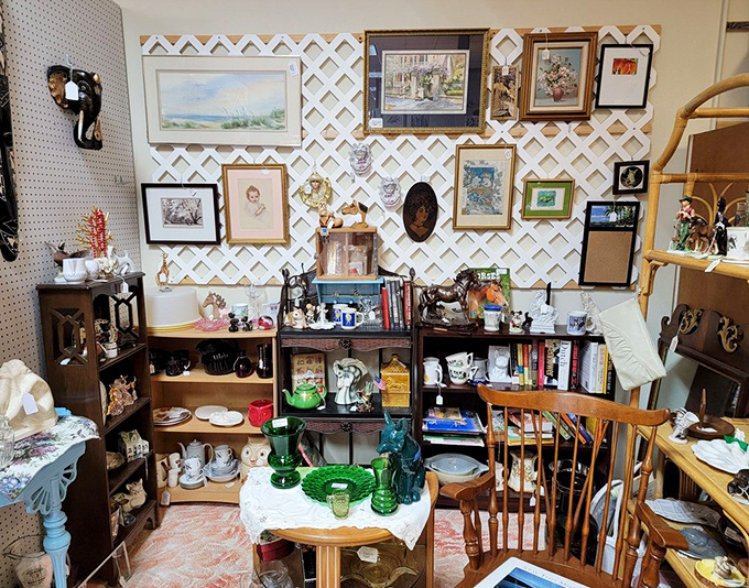 A perfectly curated booth where every shelf tells a story. That green Depression glass collection practically glows with mid-century memories waiting to be adopted.