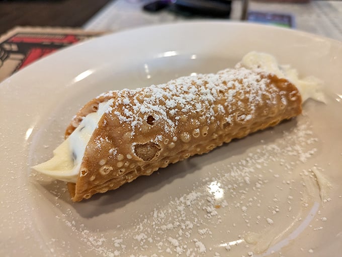 The cannoli: a crisp shell giving way to sweet, creamy filling. One bite and you'll understand why people have been fighting over these since The Godfather.