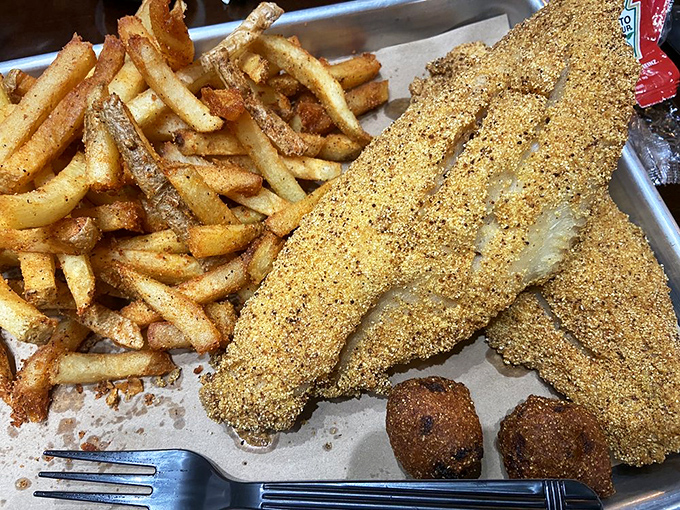 Catfish with a cornmeal crust that crackles with each bite. Proof that King's mastery extends beyond the smoker to the fryer.