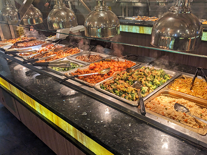 The hot food section offers a United Nations of flavors. Those serving spoons have witnessed more joy than most wedding photographers.