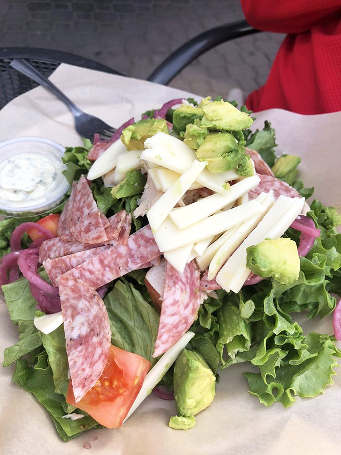 A salad that doesn't feel like punishment. Fresh greens, quality meats, and avocado create a fork-worthy alternative to bread-based options. 