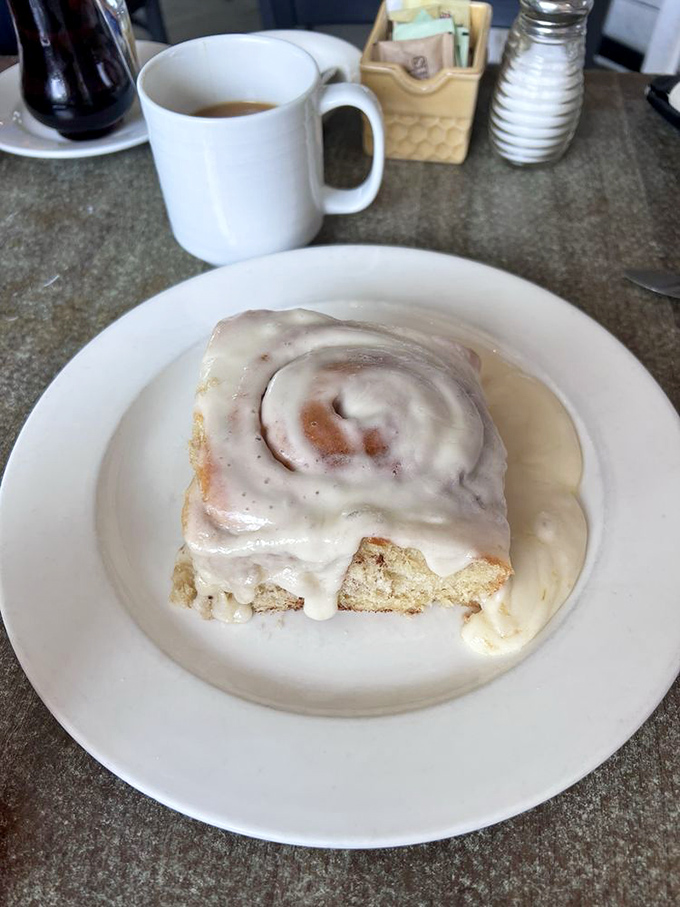 This isn't just a cinnamon roll&mdash;it's a spiral-bound love letter to morning indulgence. The icing melts with purpose, not by accident.