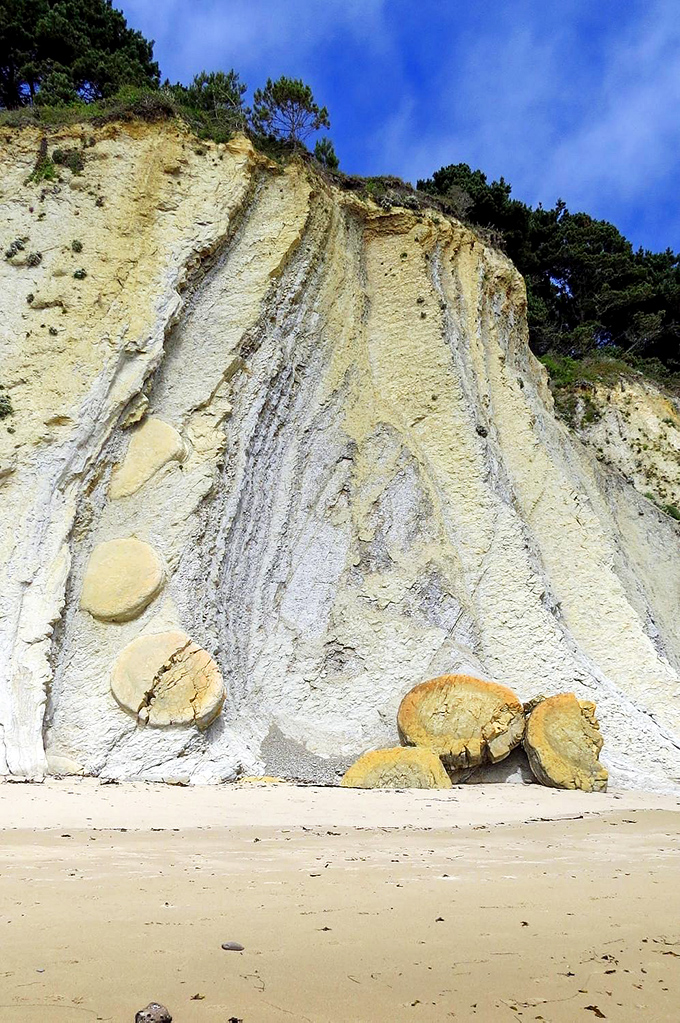 Dramatic cliffs reveal the Earth's layers like a perfectly cut geological cake. These sandstone walls have been perfecting their look for millions of years.