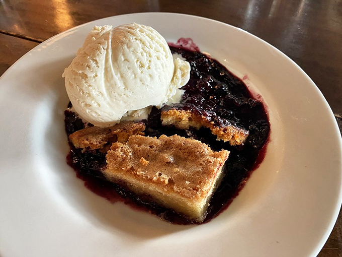 A warm berry cobbler topped with ice cream that melts into the crevices&mdash;proof that even after seafood, there's always room for dessert. 