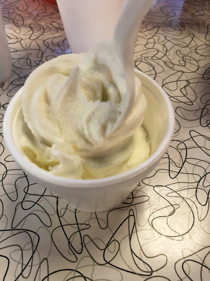 The perfect finale: a swirl of creamy vanilla ice cream that whispers, "You've earned this" after your cheesesteak adventure.