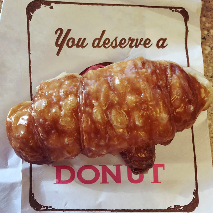 "You deserve a donut" says the wrapper. The most accurate fortune you'll ever receive, displayed on a golden croissant.