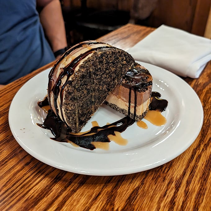 Your sweet tooth will thank you once you dive into this decadent, layered chocolate dessert drizzled with rich, indulgent syrups.