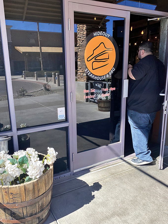 Even the entrance makes a statement with its barrel planters and logo that promises what awaits: a hideout from ordinary dining experiences.