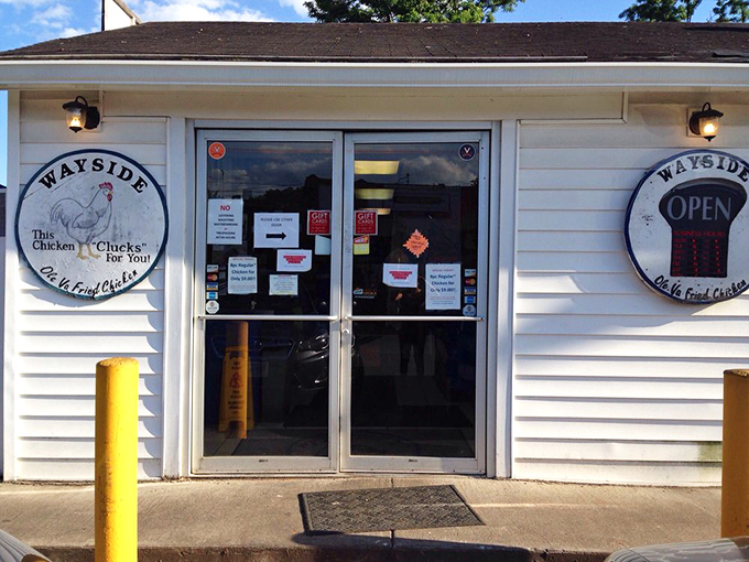The entrance to chicken paradise &ndash; where that circular "OPEN" sign might be the most beautiful sight in all of Charlottesville when hunger strikes. P