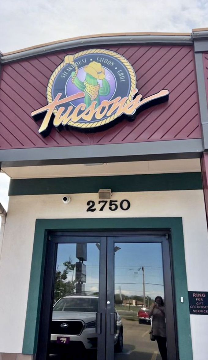 The entrance promises what awaits inside: Southwestern flair meets steakhouse tradition. That cactus logo practically winks at you as you approach.