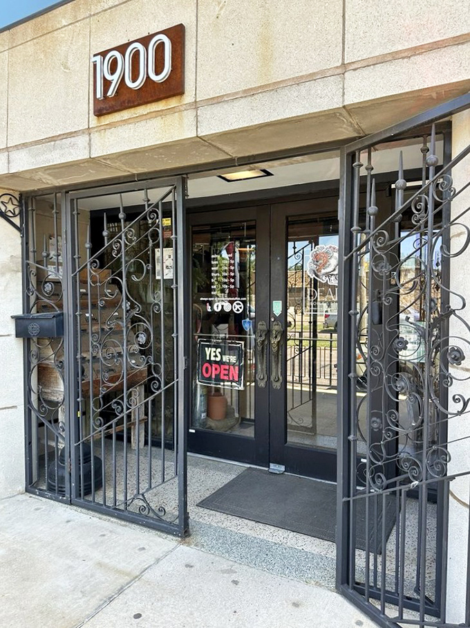 Even the entrance is a statement piece, with wrought iron scrollwork that says, "Prepare to find something you never knew you needed."