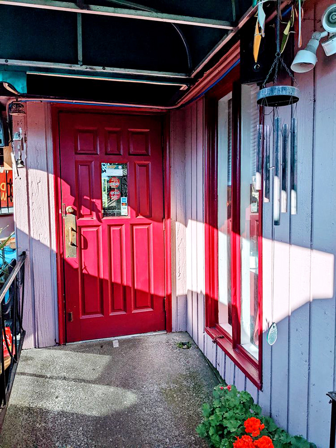 The red door stands like a portal to breakfast paradise, promising pancake treasures to those brave enough to enter. 