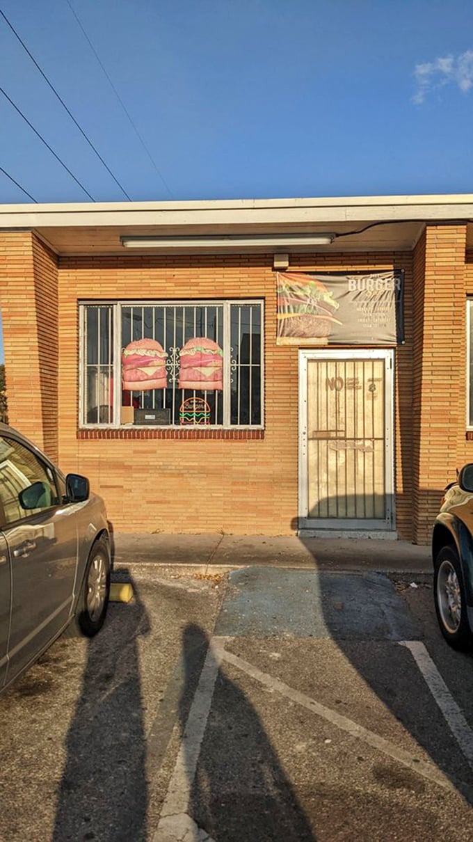 In the warm Florida sun, this humble storefront with barred windows guards its burger treasures like Fort Knox protects gold.