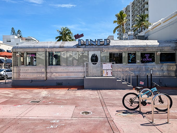 The diner's exterior in daylight reveals its true nature &ndash; a genuine piece of Americana that somehow found its perfect home in Miami's tropical landscape.