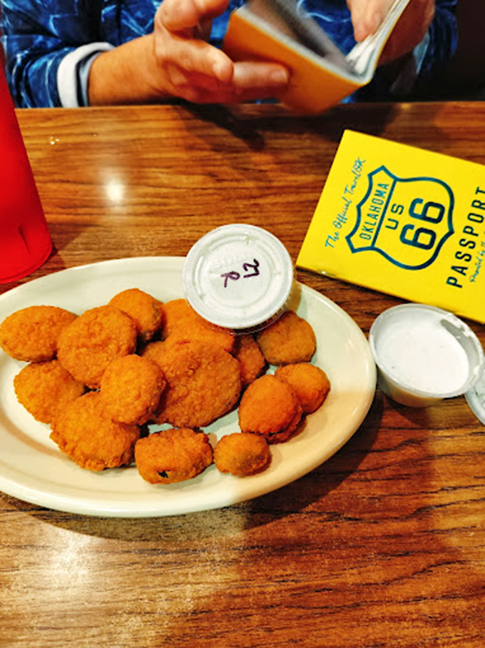 A bowl of chili that warms both body and soul, topped with cheese and served with the requisite crackers and onions for proper Oklahoma eating