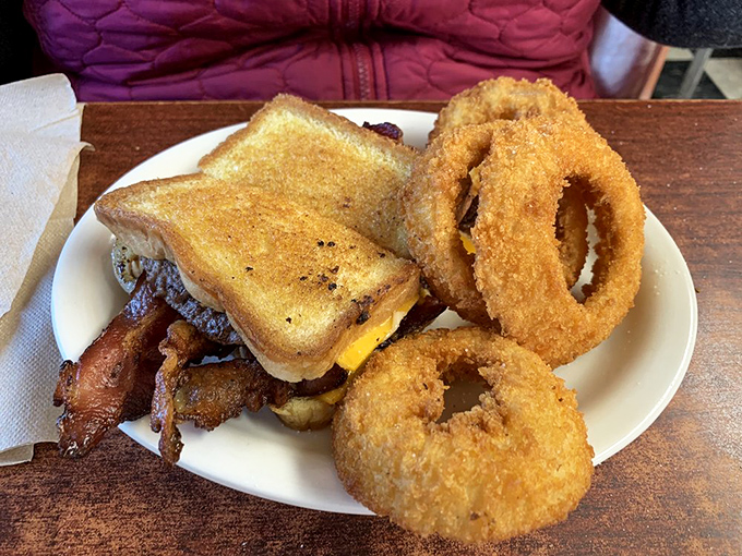 The grilled burger with onion rings represents America's most perfect food pairing&mdash;like Astaire and Rogers, if they were delicious and came with ketchup.