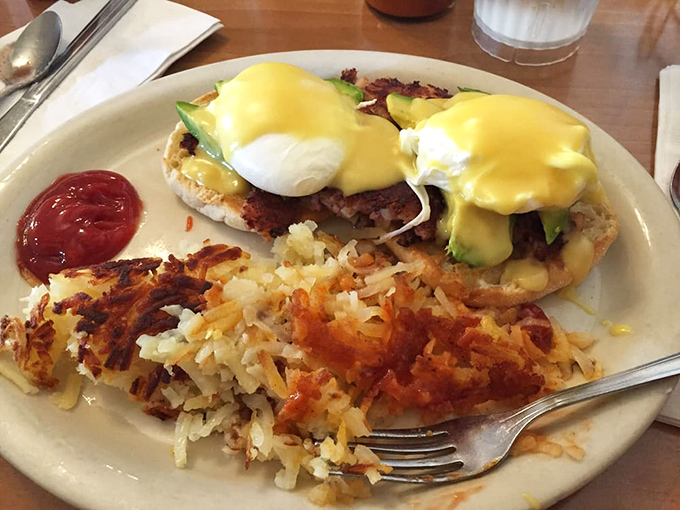 Eggs Benedict with avocado&mdash;where tradition meets California. That hollandaise sauce is performing miracles right before your eyes.