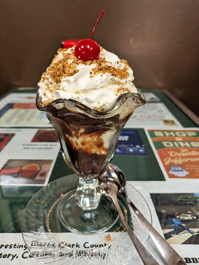 Hot fudge architecture at its finest! This mountain of cream and chocolate would make Frank Lloyd Wright weep with joy.