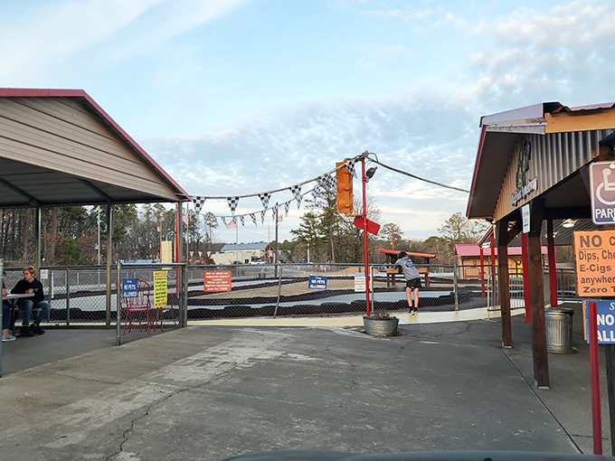 Like mission control for miniature racing, the staging area buzzes with pre-race energy and the occasional "remember, this isn't NASCAR" reminder.