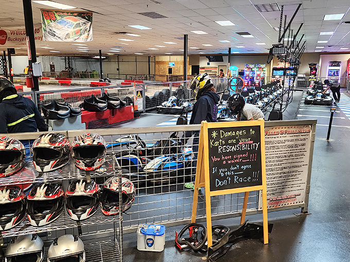 The universal warning sign of racing: "Damages to Karts are YOUR responsibility." Translation: "Drive like you own it, race like you stole it."