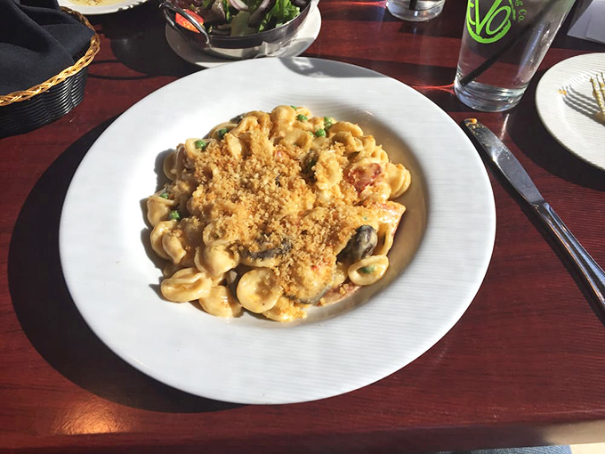 Mac and cheese that's had a glow-up. This isn't the stuff from the blue box—it's a creamy, dreamy masterpiece topped with golden breadcrumbs.