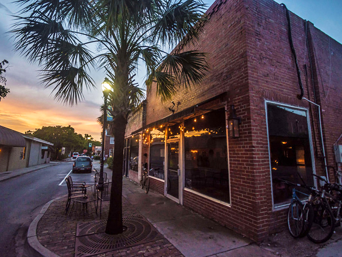 As twilight embraces this brick-faced establishment, locals gather where conversations flow as smoothly as the evening's libations.