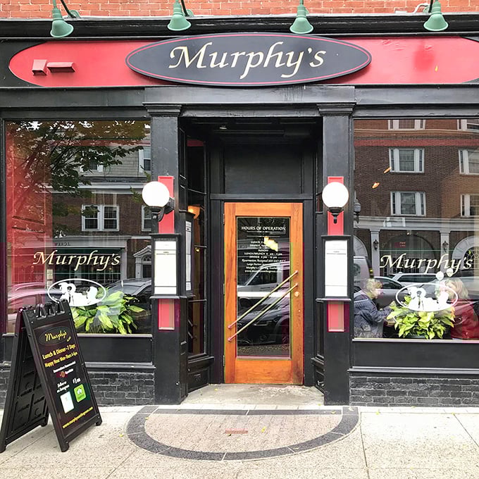 Murphy's on the Green welcomes hungry visitors with its iconic red sign. This beloved pub has fueled countless intellectual debates and celebration dinners through the years.