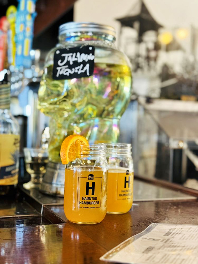 Mason jar cocktails with that signature "H" logo—because after climbing Jerome's hills, you've earned both hydration and celebration.
