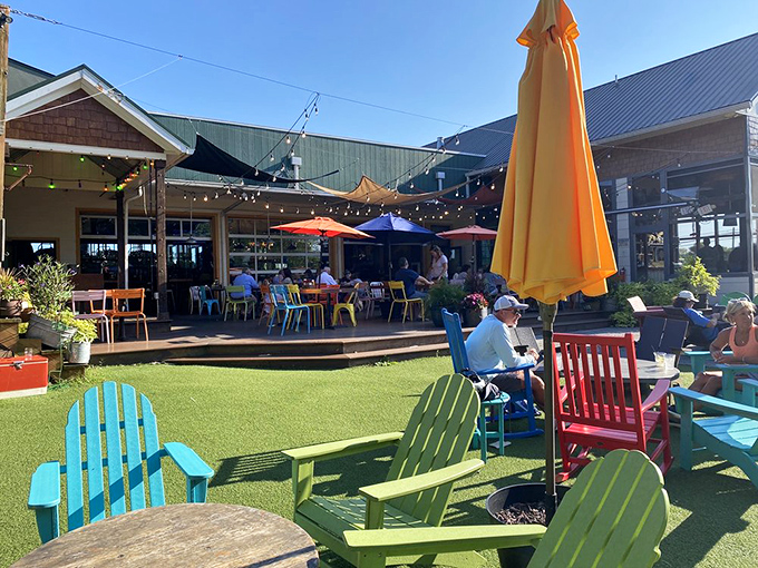 A backyard fantasy come to life &ndash; where Adirondack chairs in Crayola colors invite you to sink in, sip slowly, and forget what day it is.