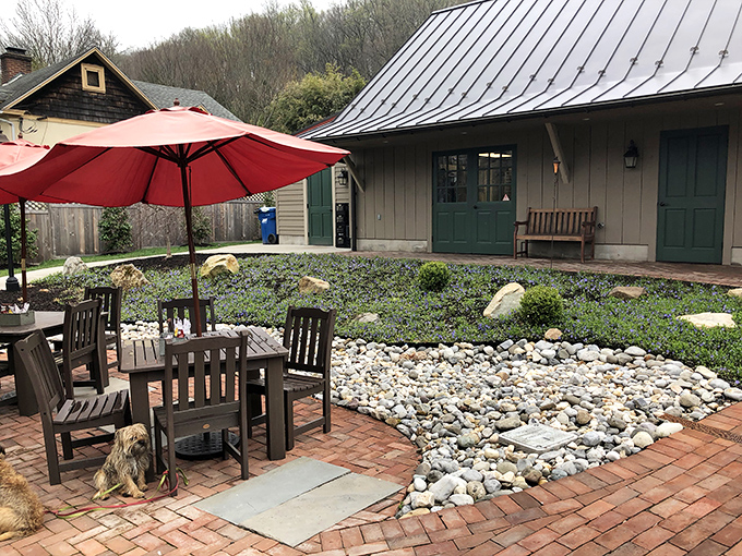 Outdoor seating that invites you to linger &ndash; red umbrellas providing shade while you contemplate ordering seconds or thirds of whatever just changed your life. 