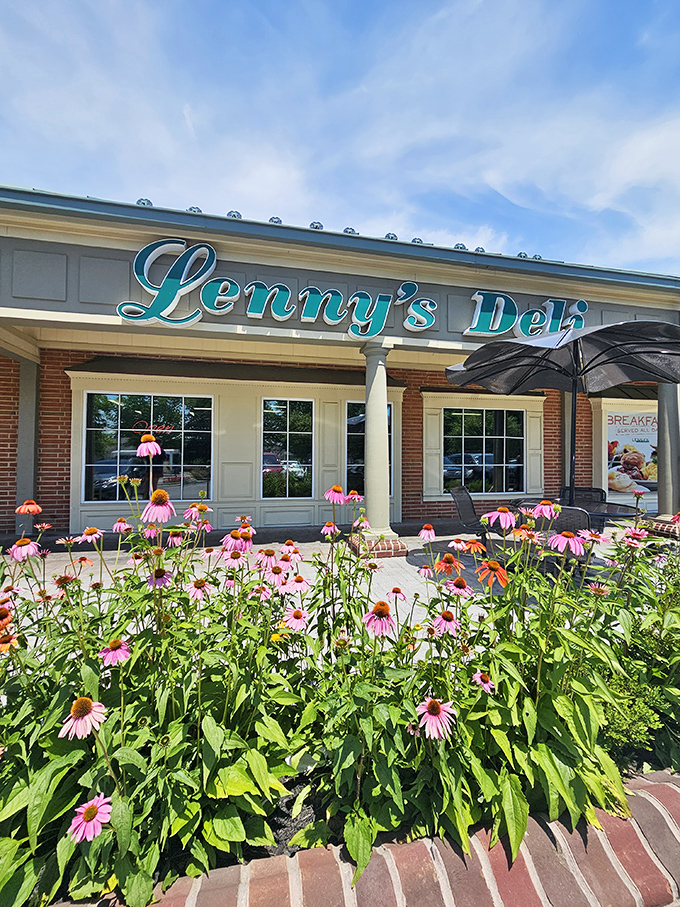 Summer at Lenny's: Where coneflowers bloom and the promise of pastrami perfection awaits behind those welcoming doors.