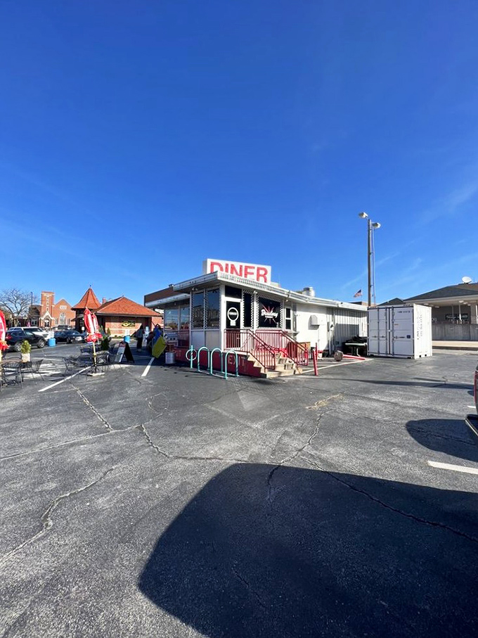From outside, it's an unassuming rectangle of happiness where neon promises and homemade pie dreams come true under Missouri skies.